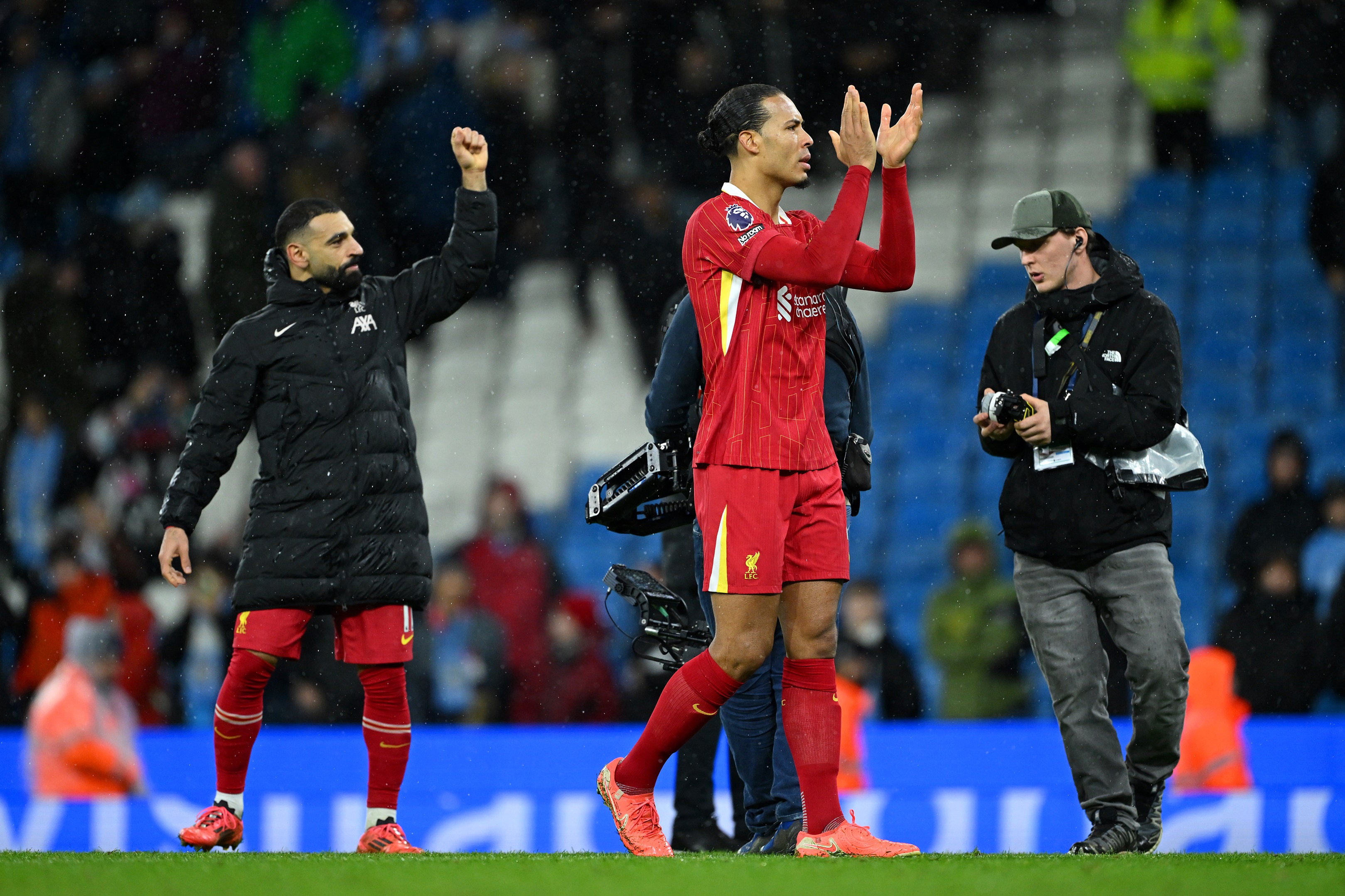Man City fans throw punches at Liverpool supporter in Etihad home end